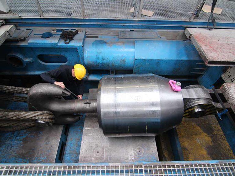 How is a crane hook tested?